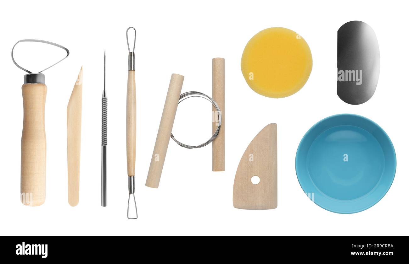 Set of pottery tools and ceramic bowl on white background Stock Photo ...
