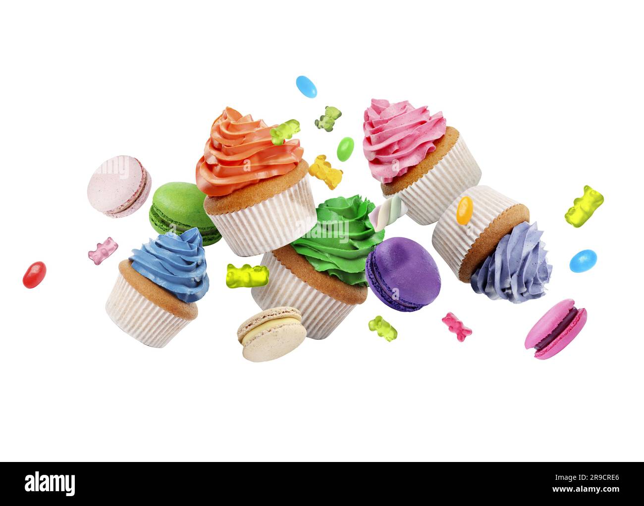 Many delicious sweets flying on white background. Cupcakes, macarons ...