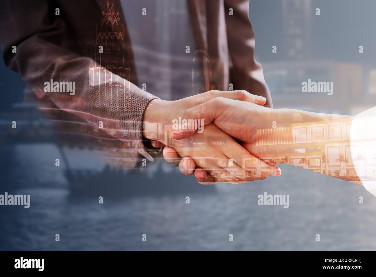 Double exposure of partners shaking hands and cityscape Stock Photo - Alamy