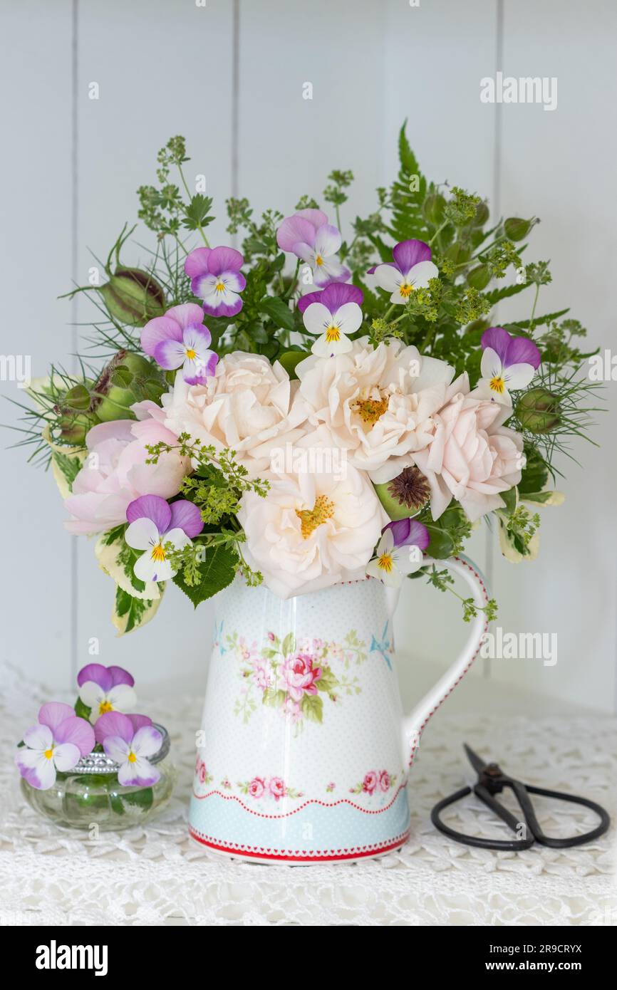 bouquet of white roses, viola flowers, devil-in-the-bush and lady's ...