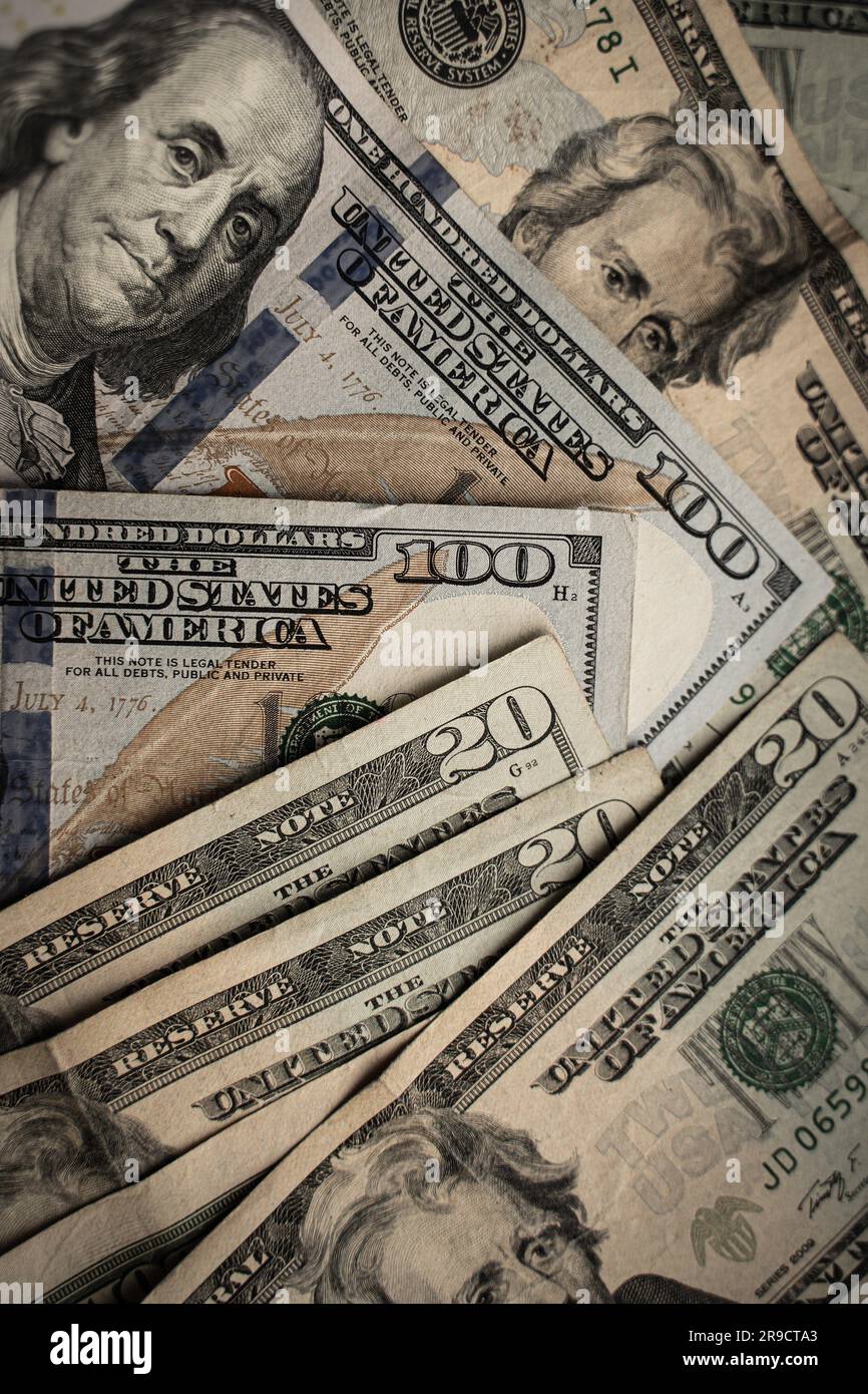 An arrangement of multiple hundred and twenty US Dollar bills placed ...