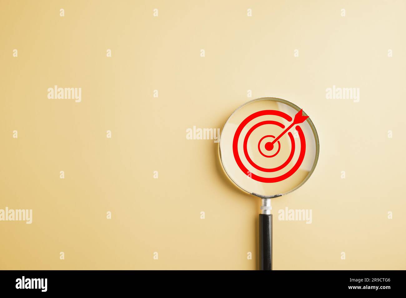 Target board inside magnifier glass for focus business objective Stock ...