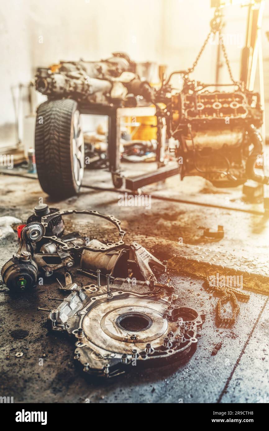 disassemble the engine from the car in the car workshop Stock Photo - Alamy