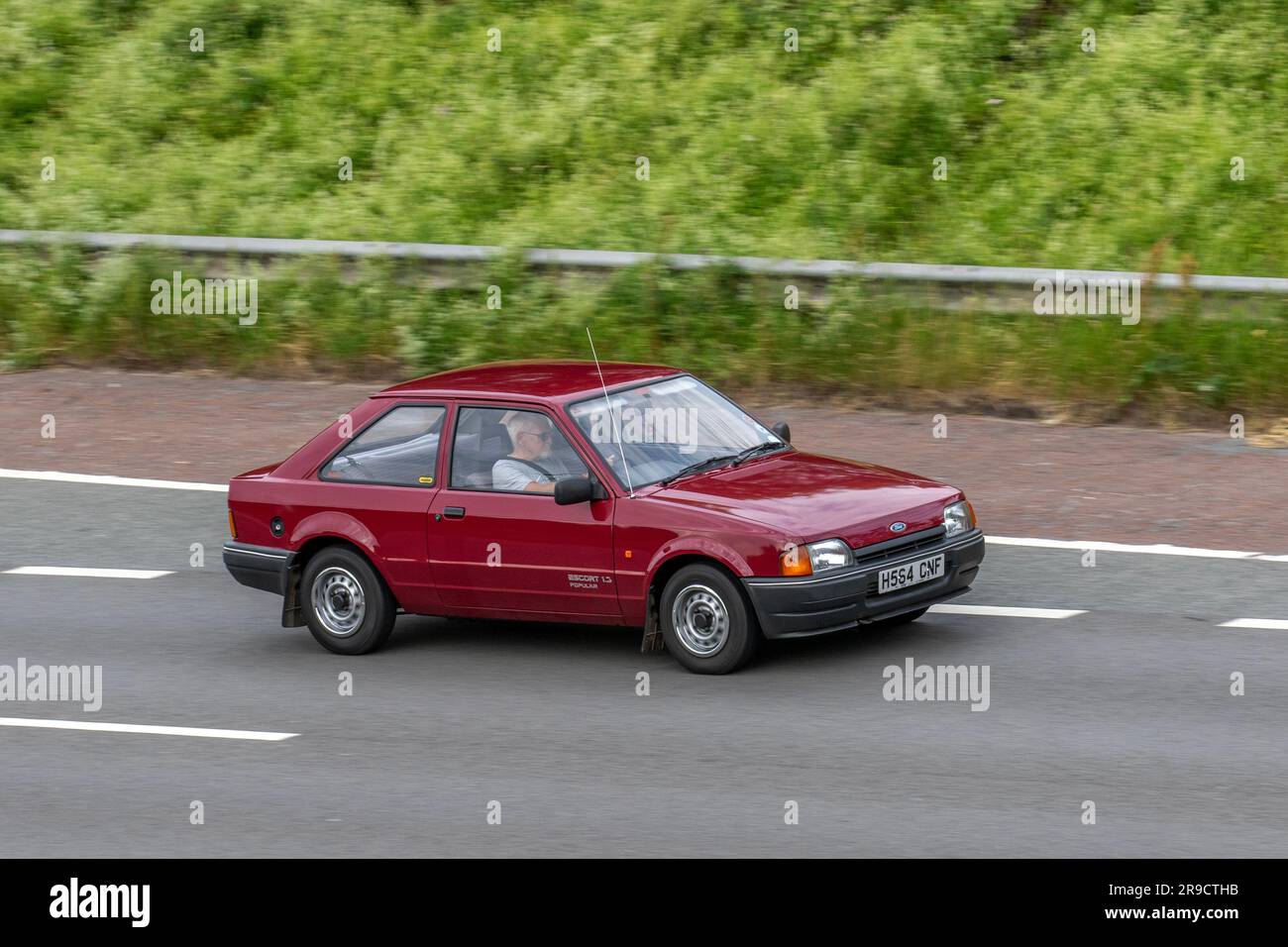 1990 90s nineties Red Ford Escort XR3i Popular; travelling at speed on ...