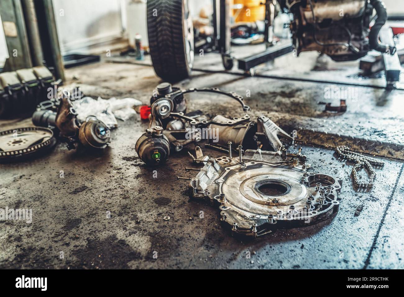 disassemble the engine from the car in the car workshop Stock Photo - Alamy