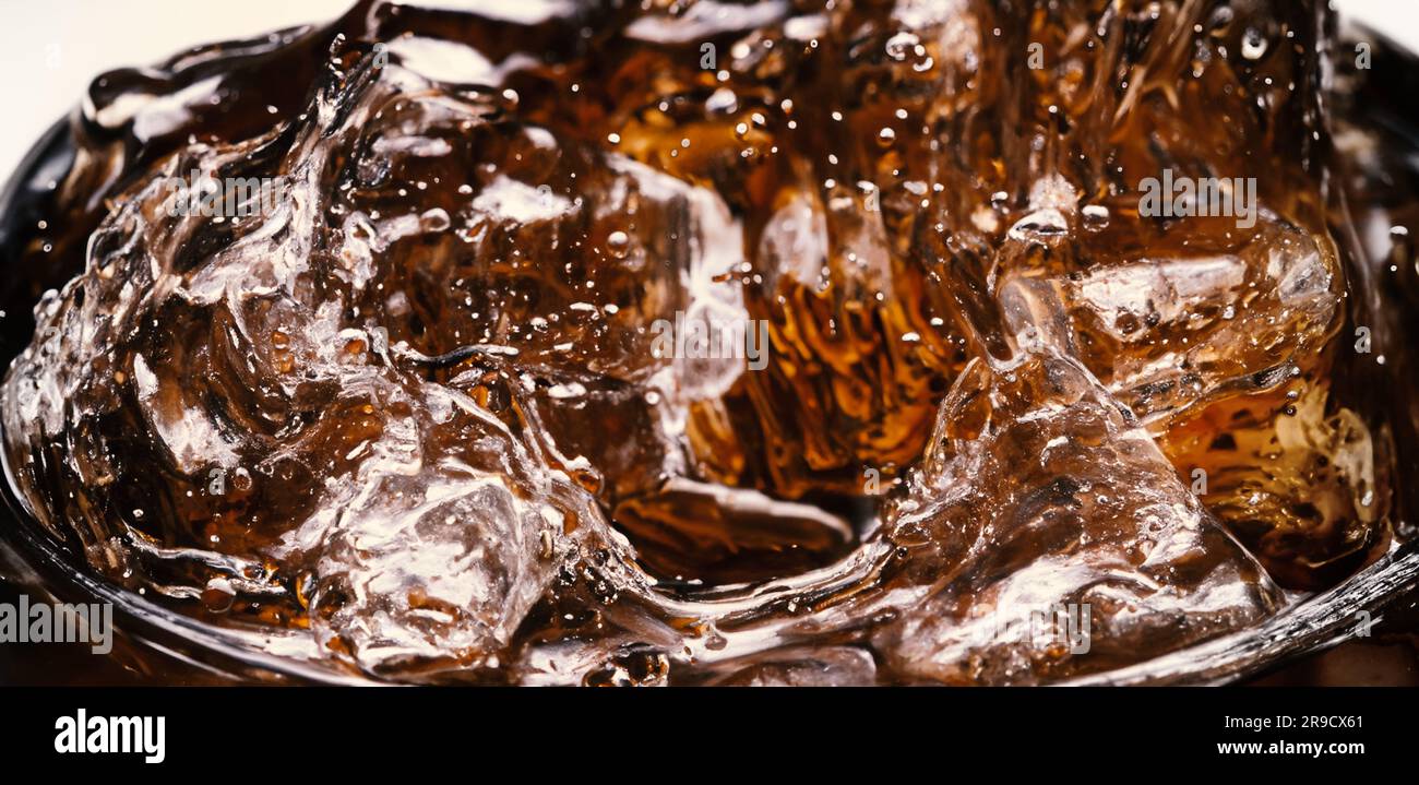 Splashing of Cola and Ice. Cola soda and ice splashing fizzing or ...
