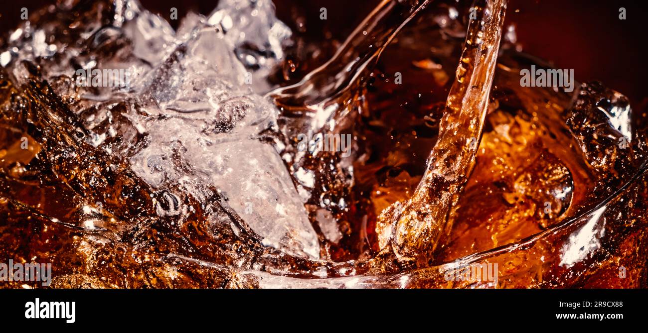 Splashing of Cola and Ice. Cola soda and ice splashing fizzing or ...