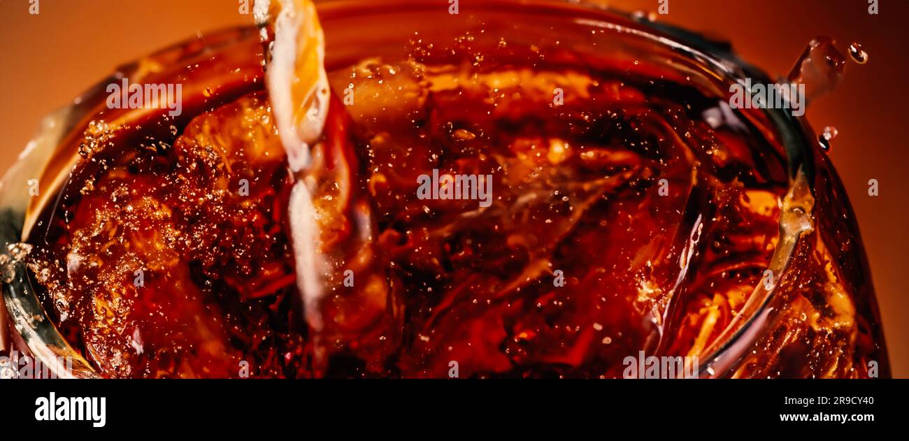 Splashing of Cola and Ice. Cola soda and ice splashing fizzing or ...