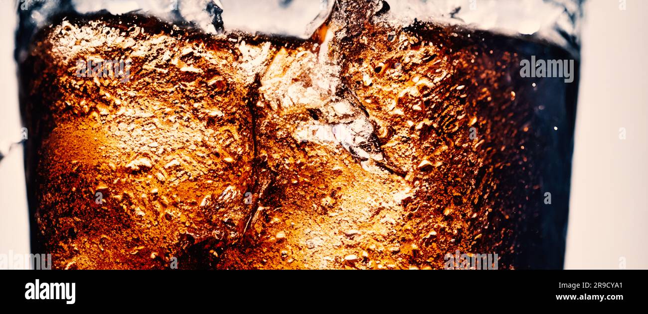 Splashing of Cola and Ice. Cola soda and ice splashing fizzing or ...