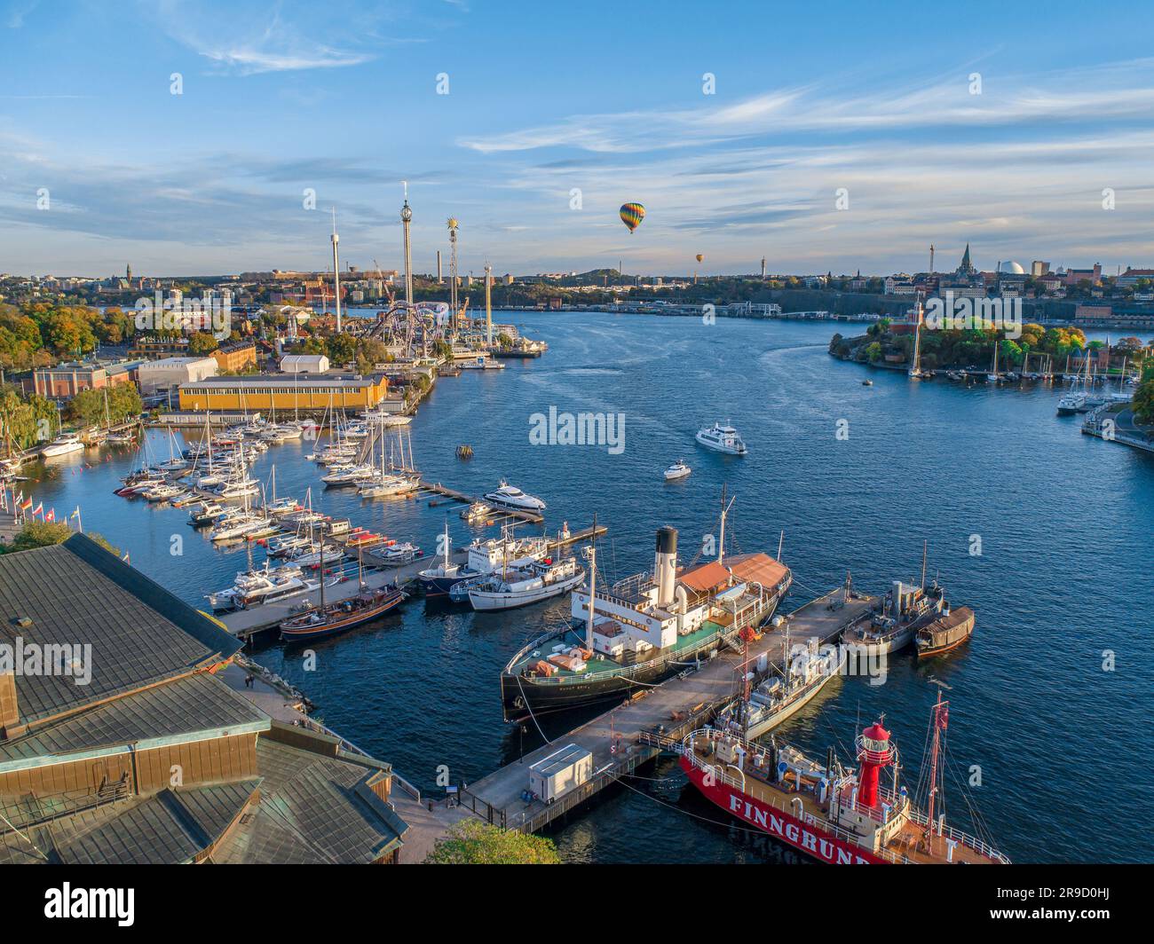 View of amusement park Grona Lund with carousels and tour rides on ...