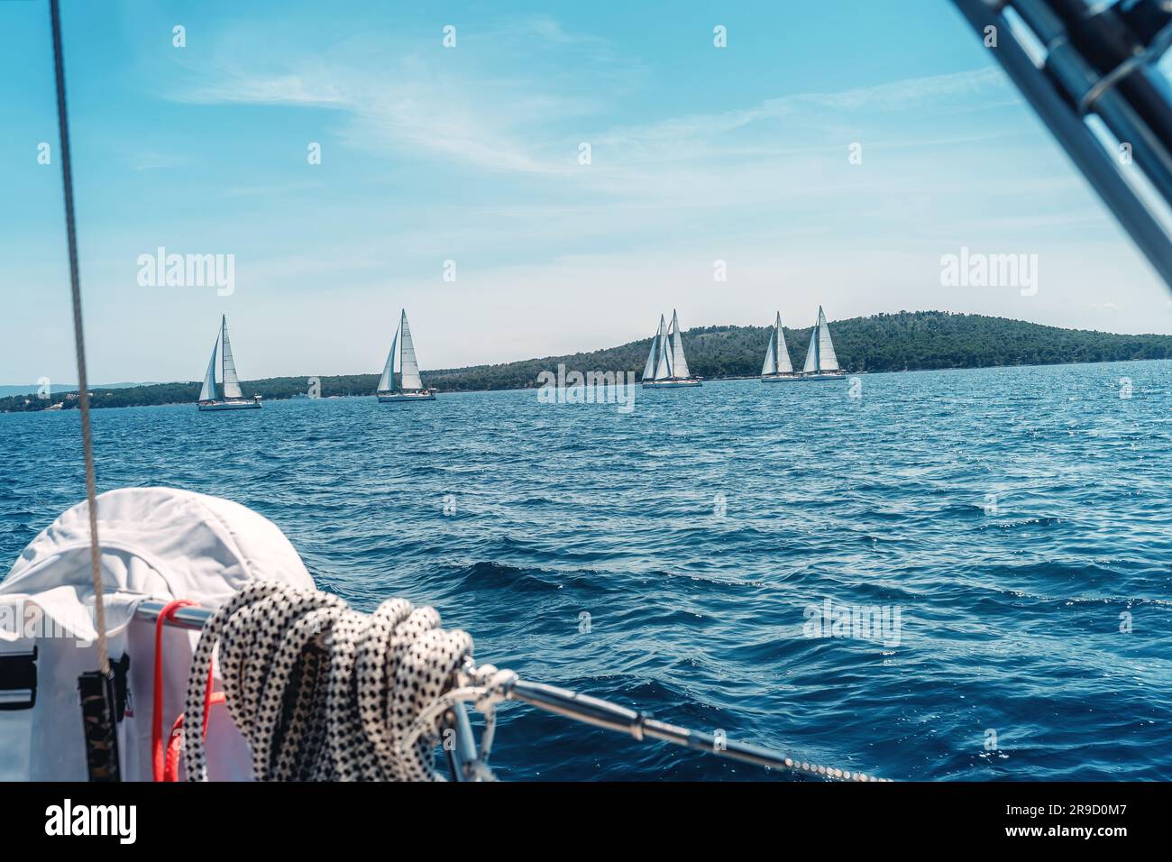 sailing yacht boat driving on the sea while running, view of a group of ...