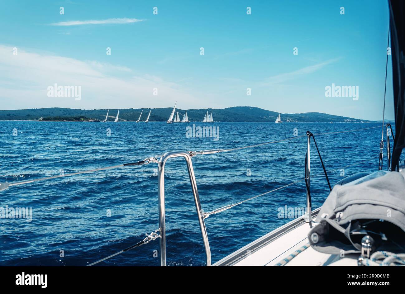 sailing yacht boat driving on the sea while running, view of a group of ...