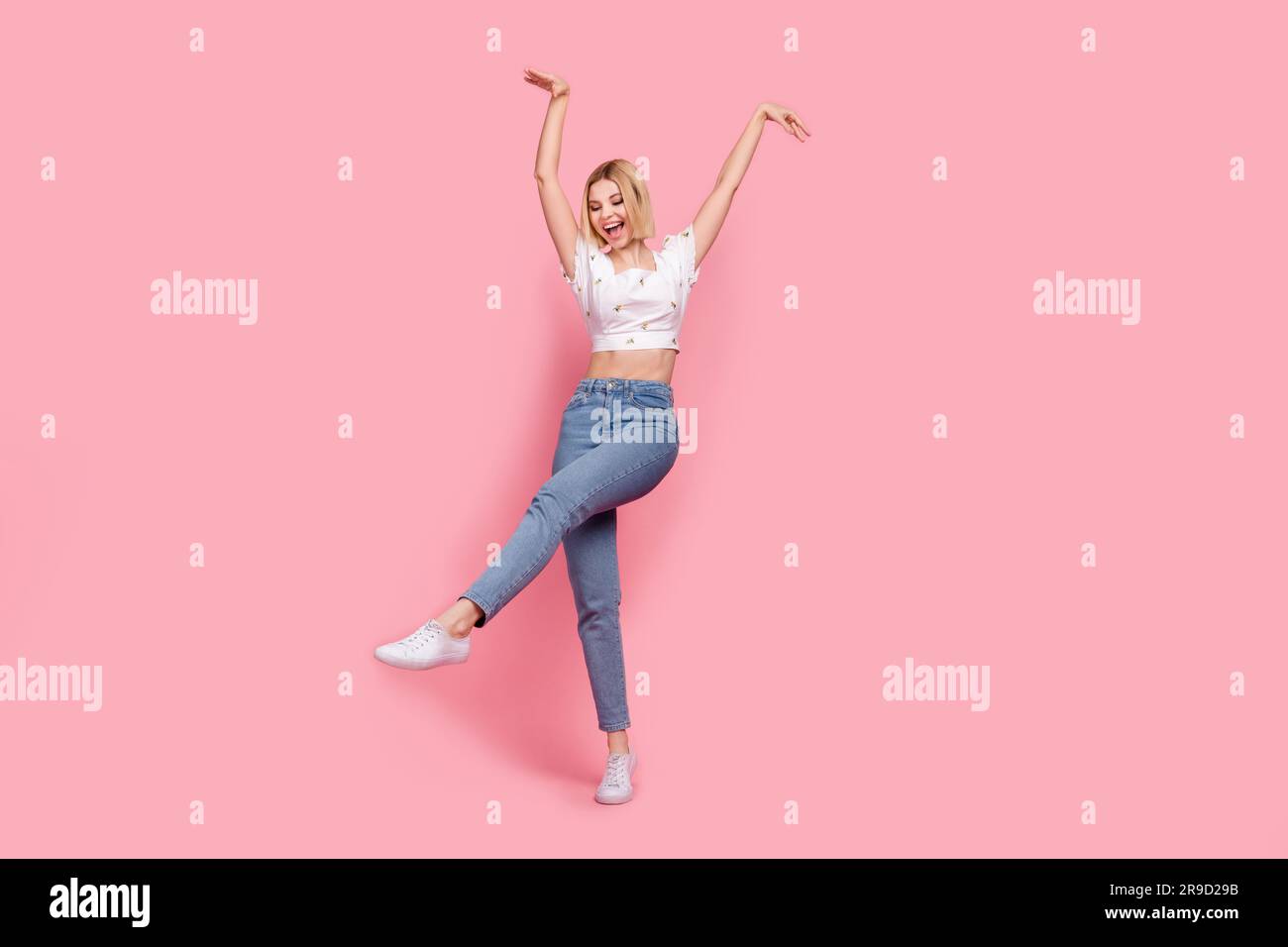 Full body photo of young careless lady wear denim jeans trendy blouse ...