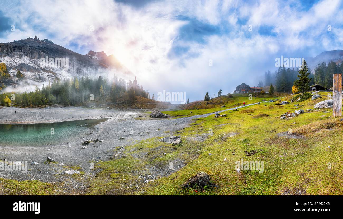 Incredible autumn view of Oeschinensee Lake. Scene of Swiss Alps with ...