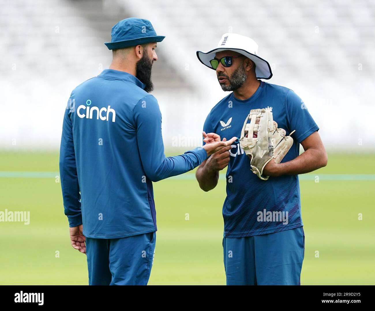 England's Moeen Ali shows his finger to spin coach Jeetan Patel during ...