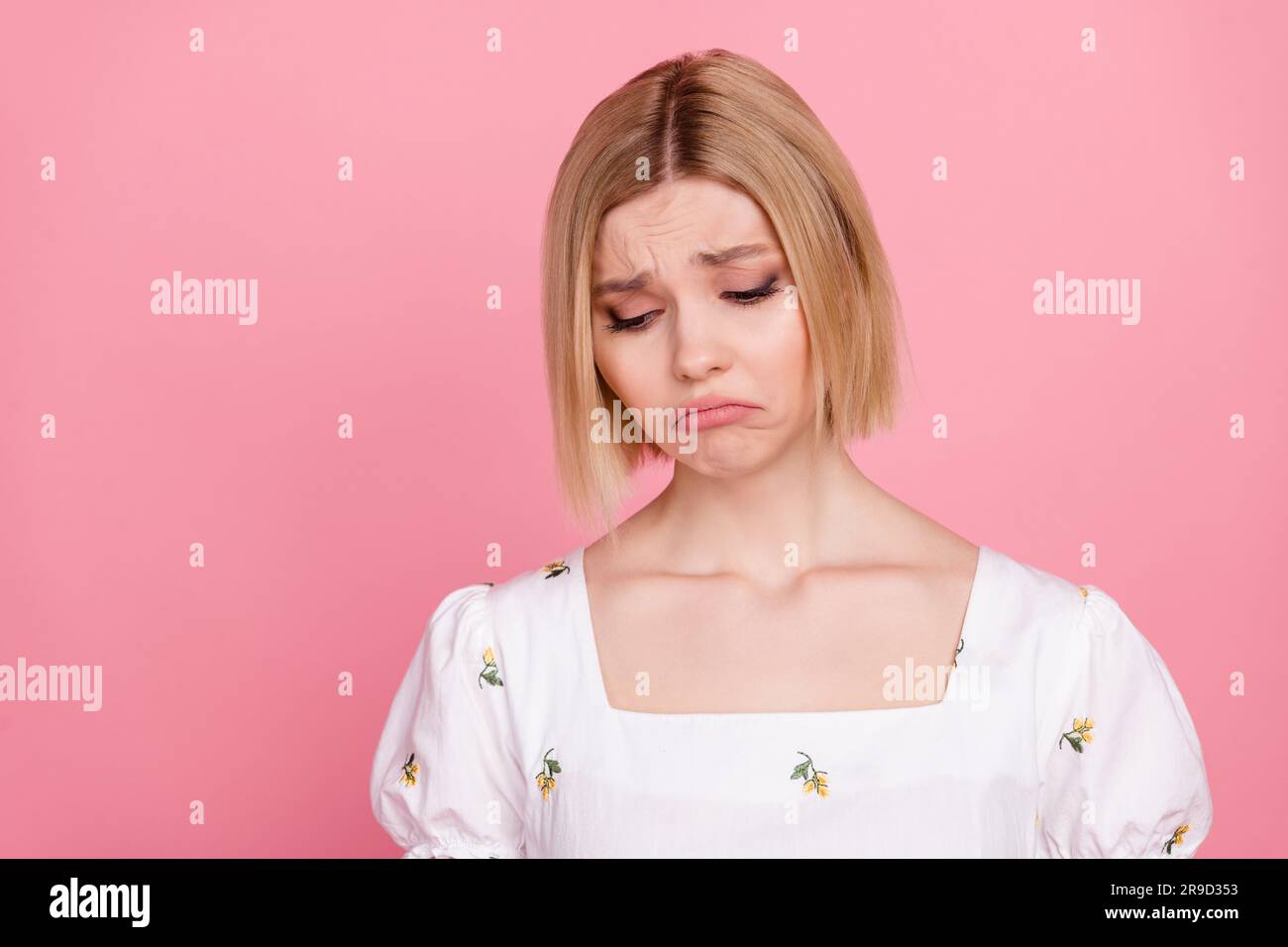 Portrait of sad young girl crying sullen unsatisfied looking down bad ...