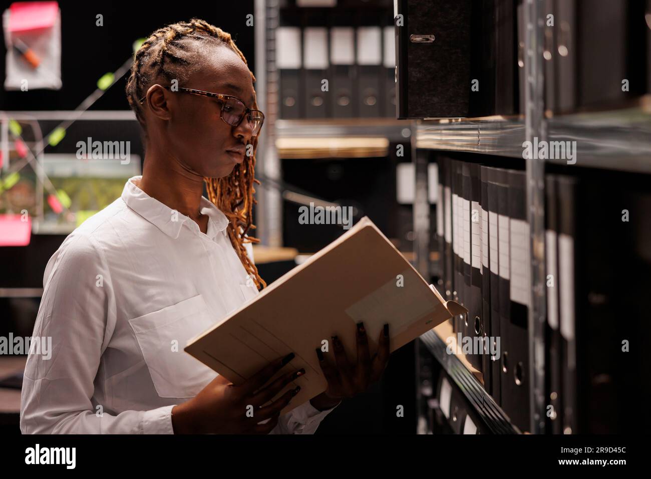 African american woman law enforcement professional reading police ...