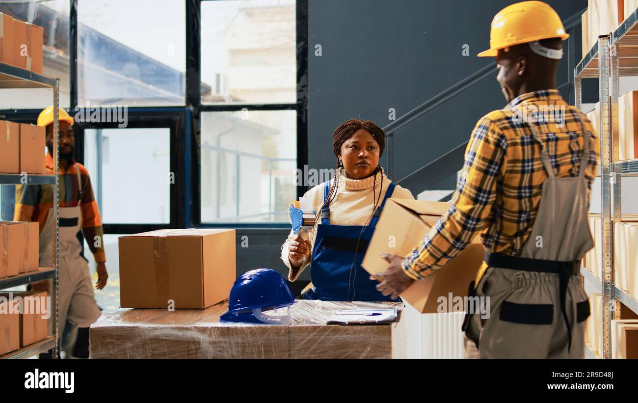 Workers team preparing goods shipment on shelves, working with ...