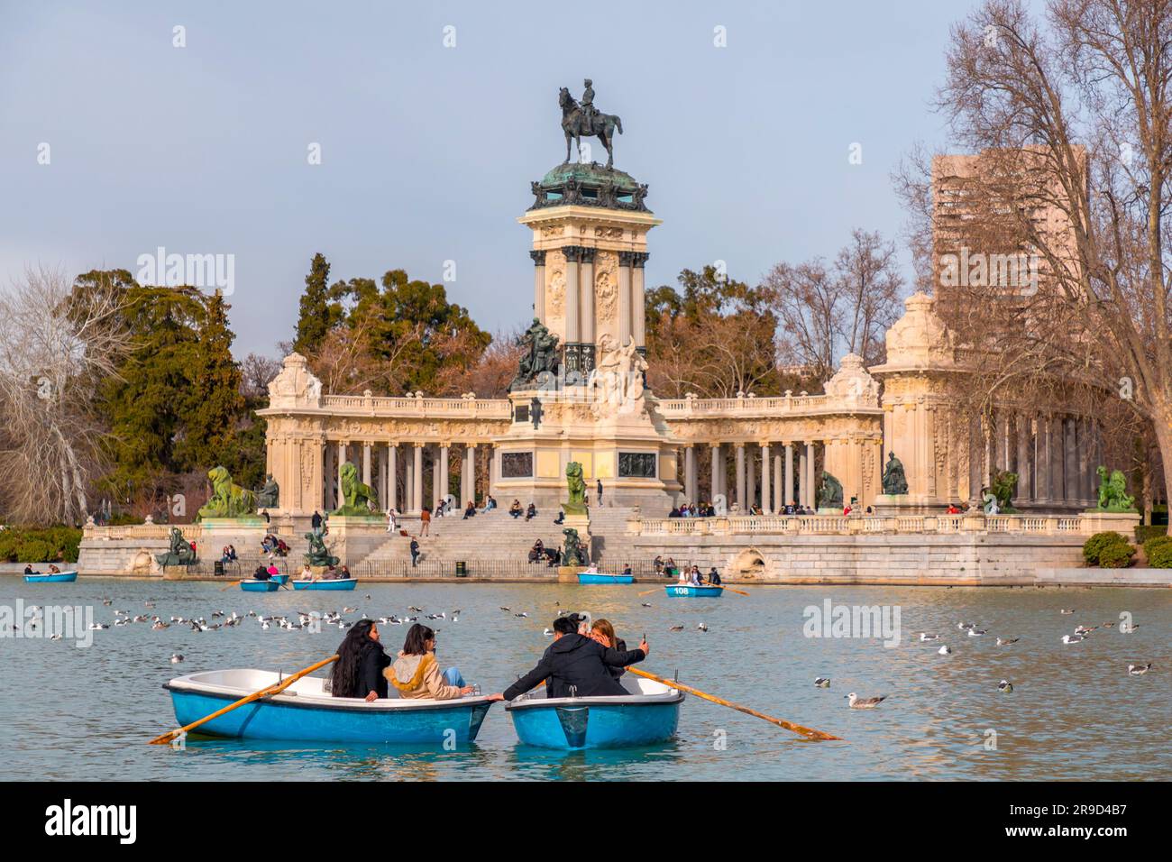 Madrid, Spain - FEB 16, 2022: People having fun on rowing boats on the ...