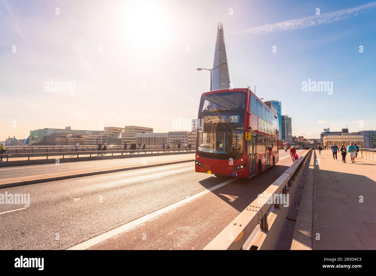 London bridge with red bus and the Shard in the background Stock Photo ...