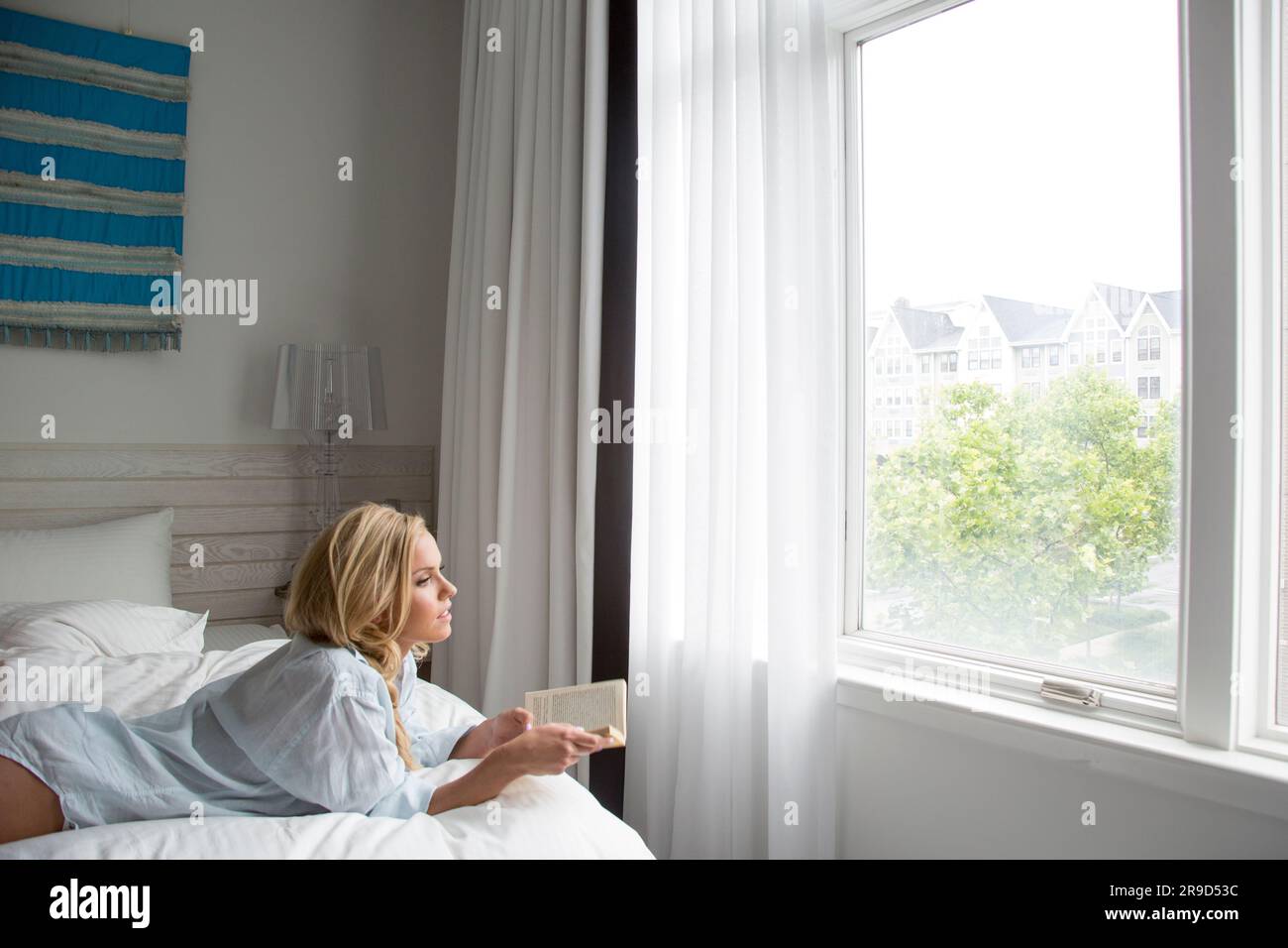 Gazing out of a window hi-res stock photography and images - Alamy