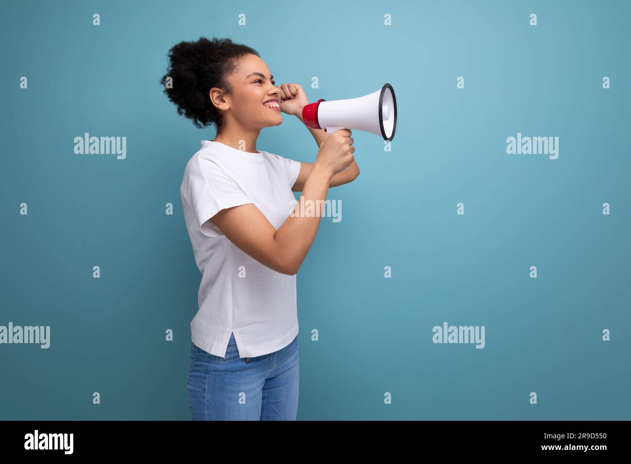 Woman speaking through megaphone in hi-res stock photography and images ...