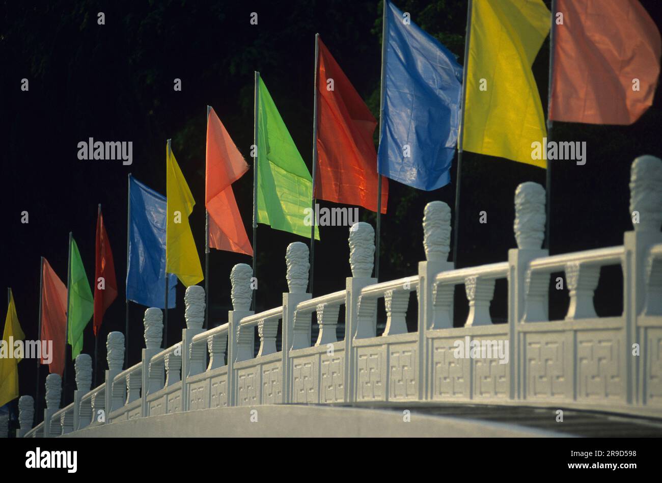Footbridge with colorful flags in Singapore Stock Photo - Alamy