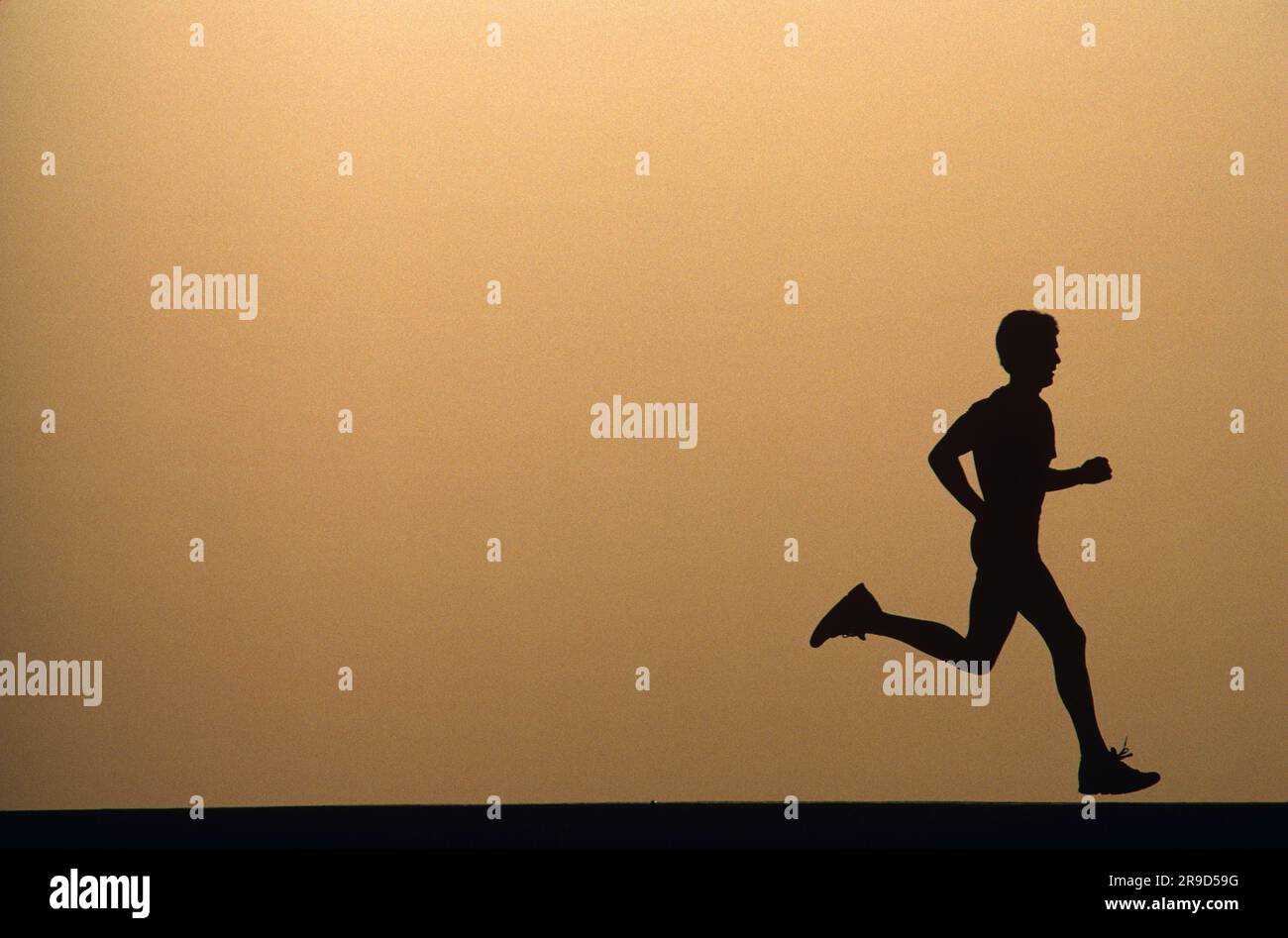 Silhouette of man running Stock Photo - Alamy