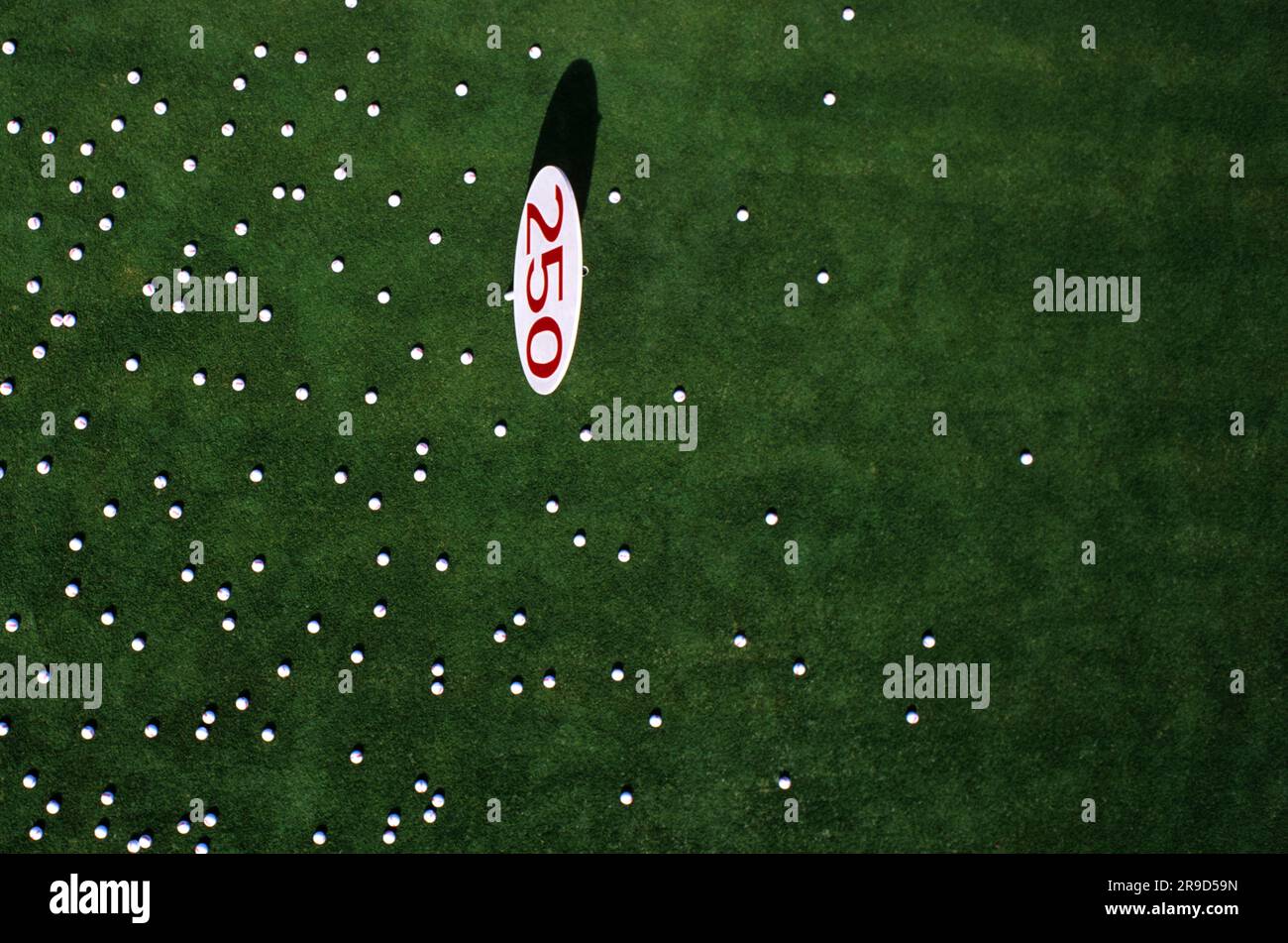 View of 250 yard driving range marker from above with golf balls ...
