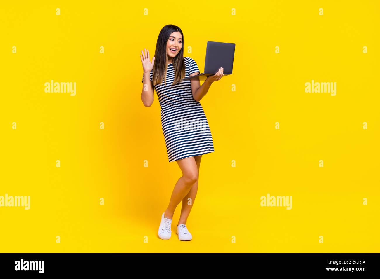 Full length photo of cute friendly woman dressed striped outfit waving ...