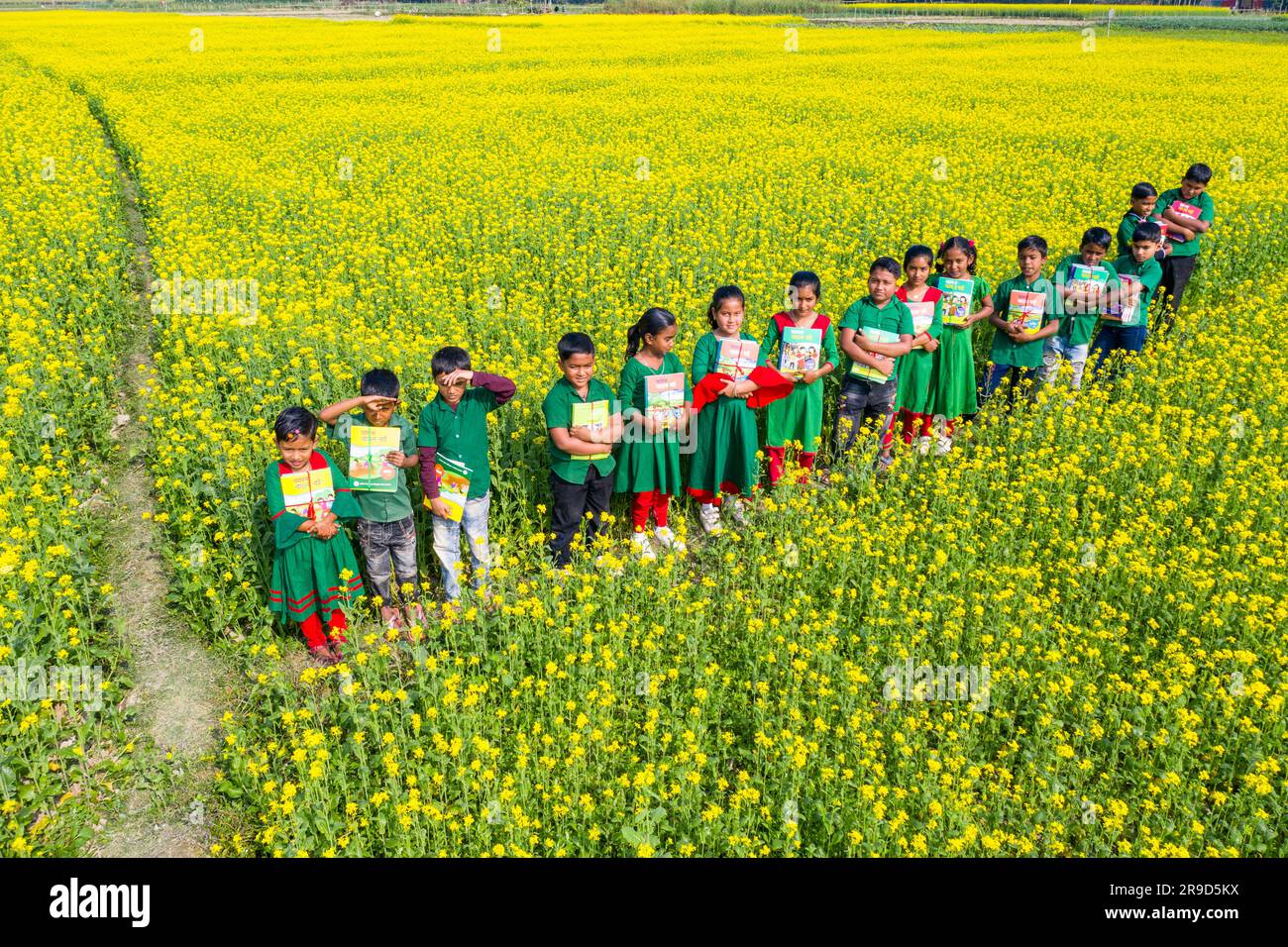 Bangladeshi primary school students celebrate as they get their new ...