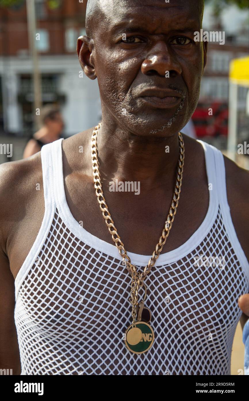 London, UK. 24th June, 2023. A man looks on as people gather in ...