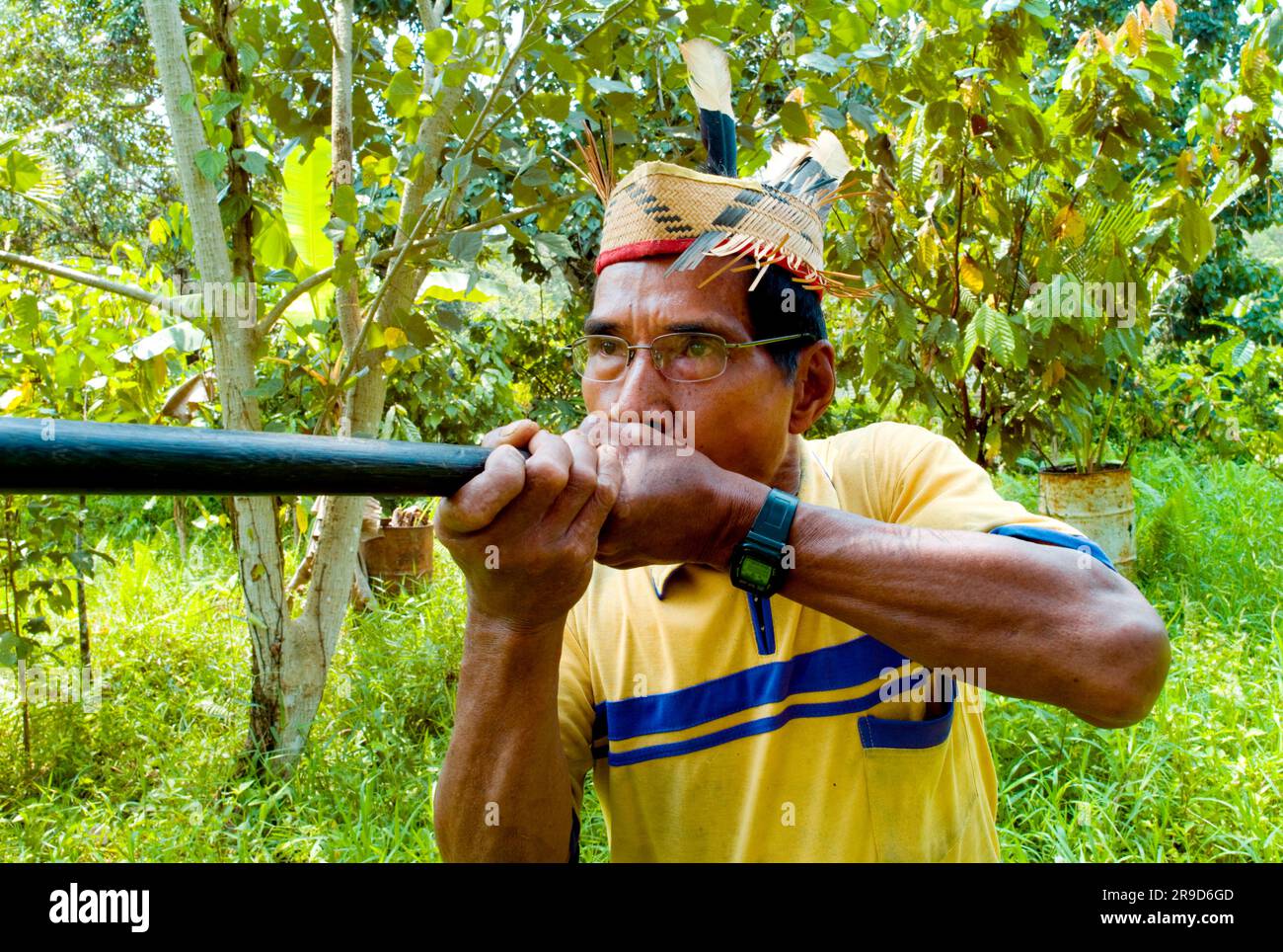 Village traditional leader demonstrating blow gun technique Stock Photo ...