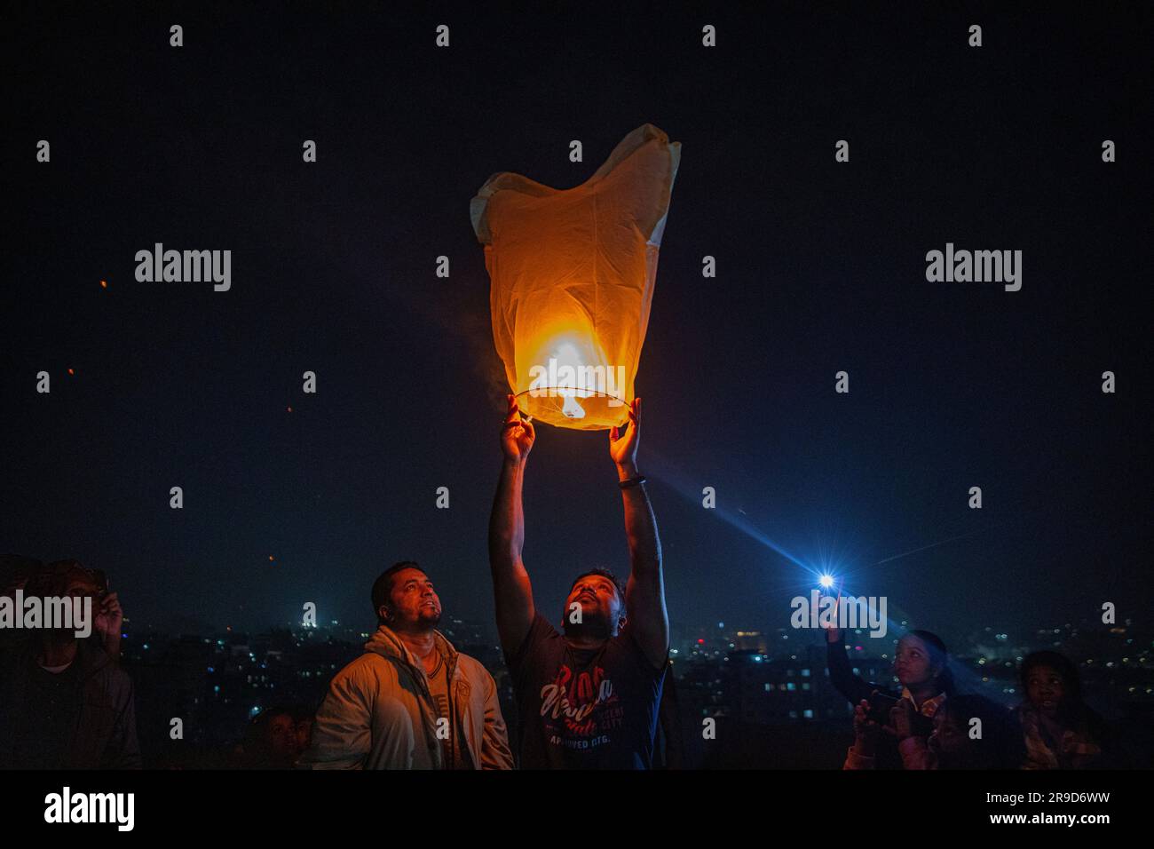 Dhaka Residents flying paper lantern (Fanush) on a rooftop of an ...