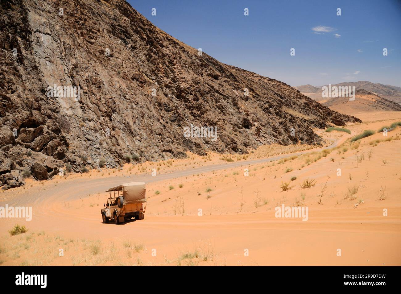 4x4 tour vehicle on San dunes, Serra Cafema Wilderness Safaris at ...