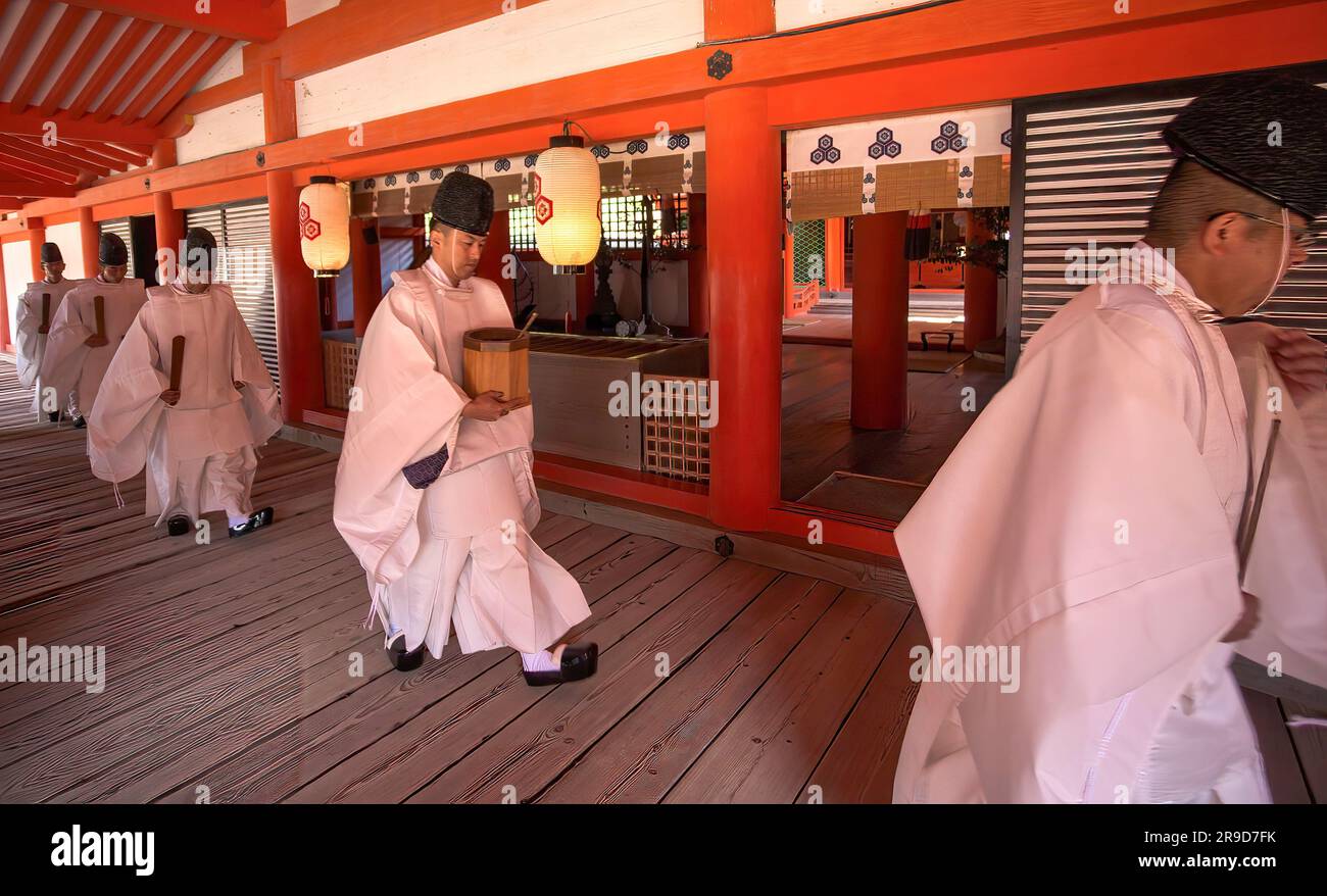 Morning ritual at the Itsukushima shrine Stock Photo - Alamy