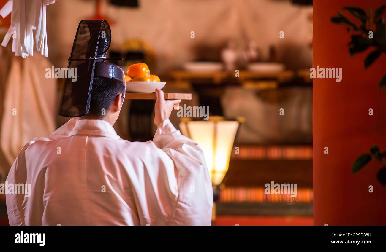 Morning ritual at the Itsukushima shrine Stock Photo - Alamy