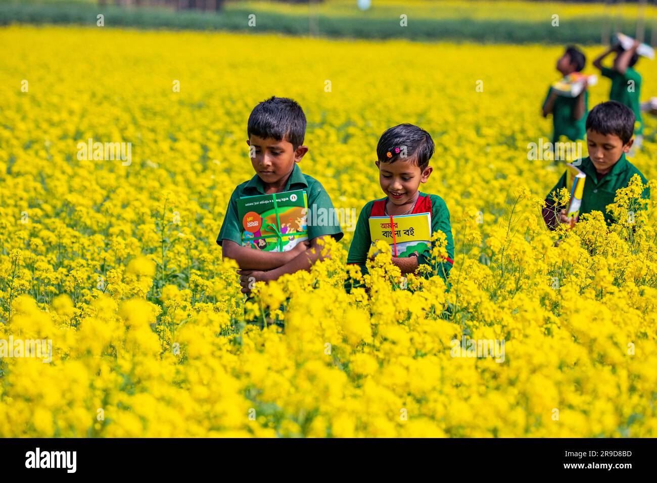 Bangladeshi primary school boys and girls returning home through a ...