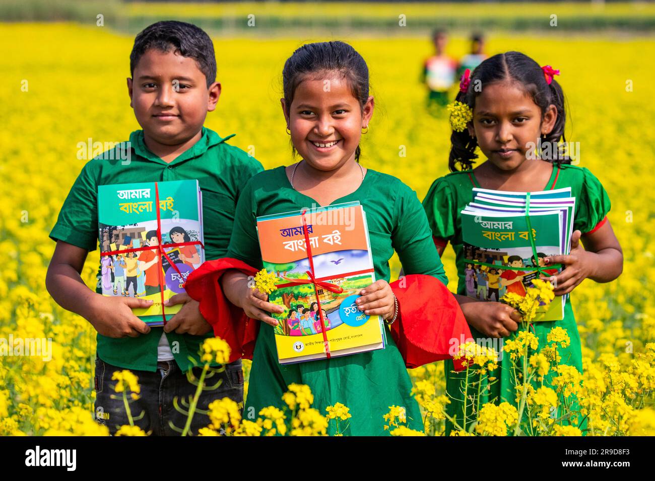 Bangladeshi primary school boys and girls returning home through a ...