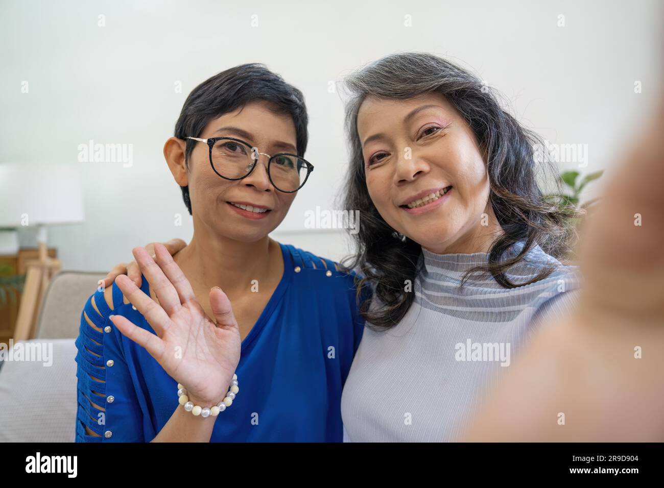 Two overjoyed retired middle aged female smile taking funny selfie ...
