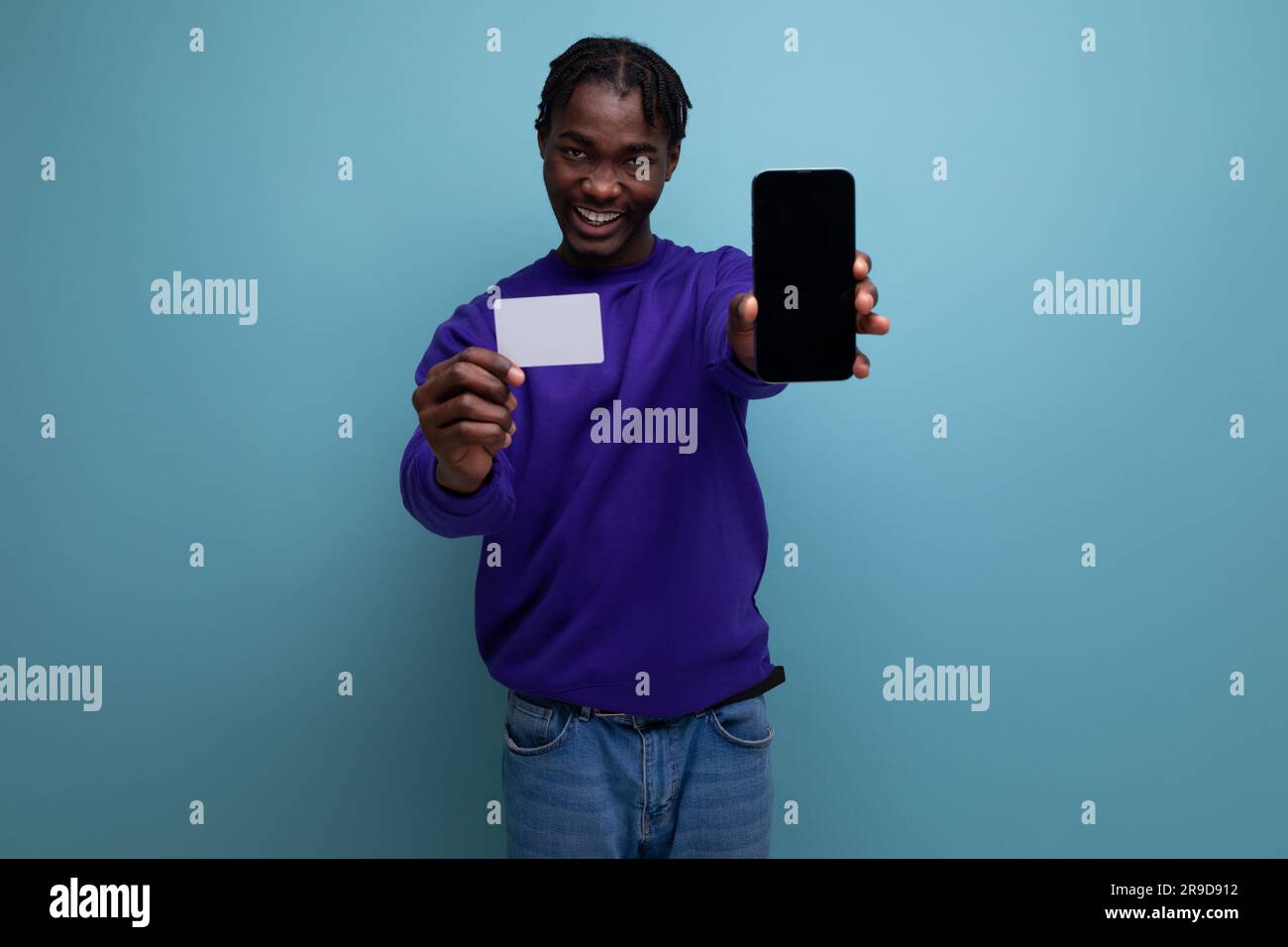 american young brunette male with dreadlocks holding card and ...