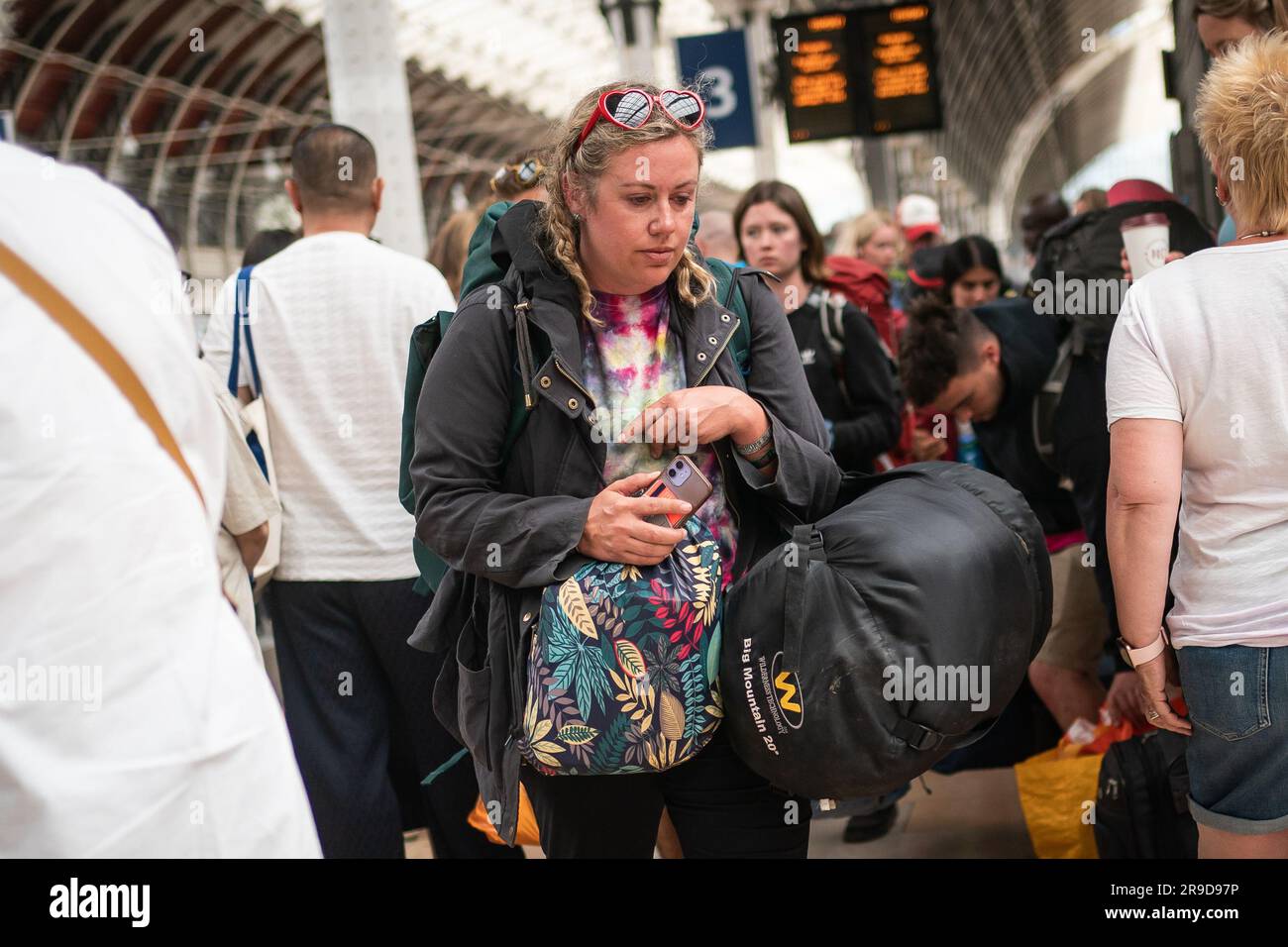 Glastonbury festivalgoers arrive back at Paddington Station, London ...