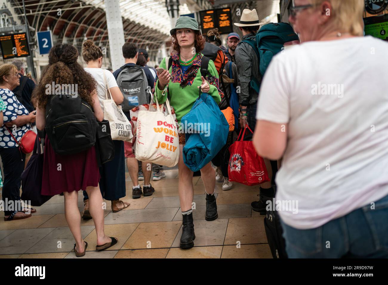Glastonbury festivalgoers arrive back at Paddington Station, London ...