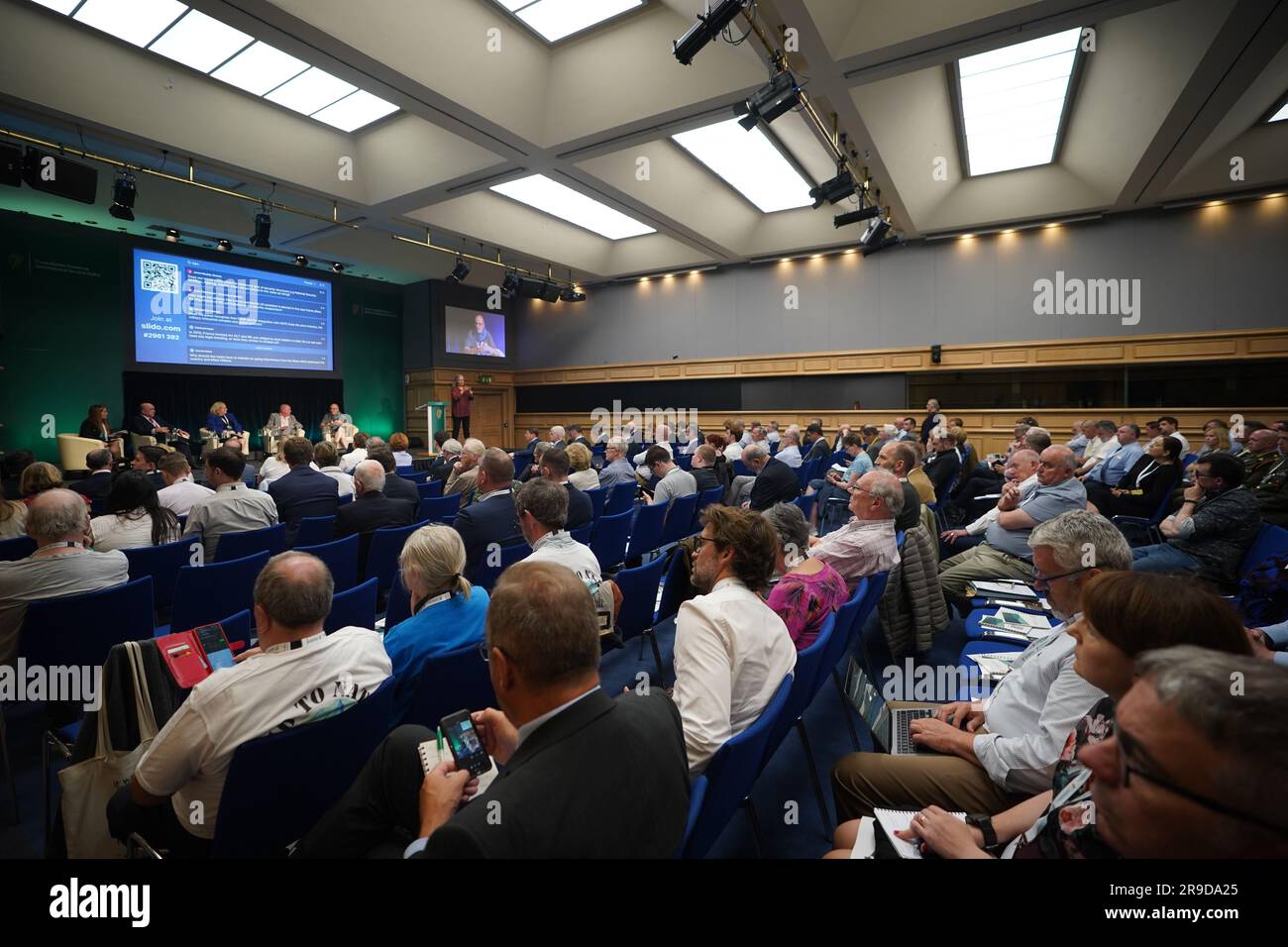 People listen to speeches during the third day of the Consultative ...