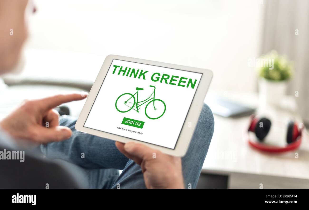 Tablet screen displaying a think green concept Stock Photo - Alamy