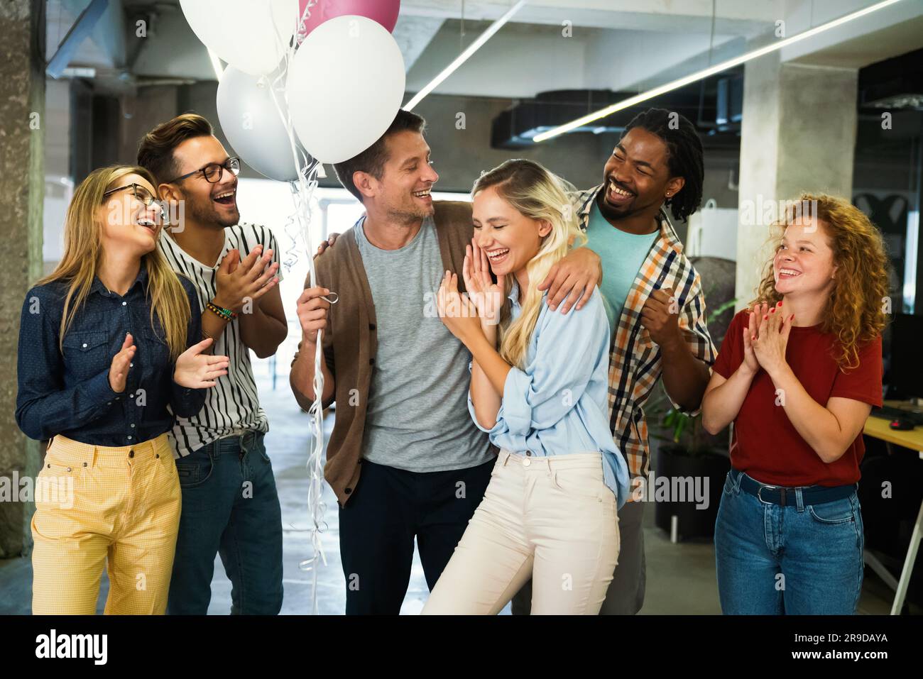 Happy multiracial group of business people having fun while celebrating ...
