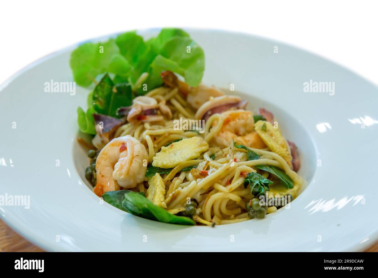 Die cut of Die cut of Spaghetti with spicy prawn and squid on white ...