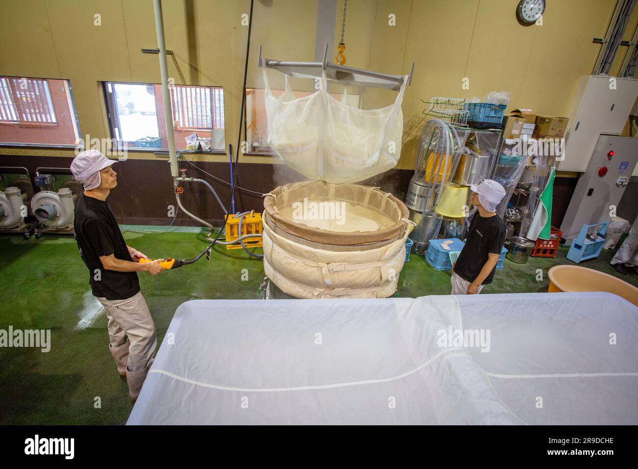 Sake brewer steaming rice for sake at Sake Brewery in Akashi ,Hyogo ...