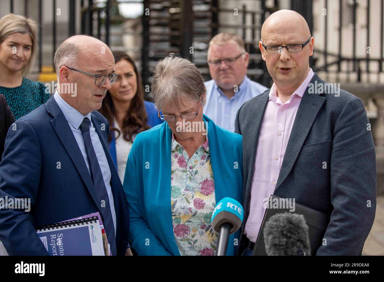 (left to right) Solicitor Adrian O'Kane, Patsy Kelly's widow Teresa and ...