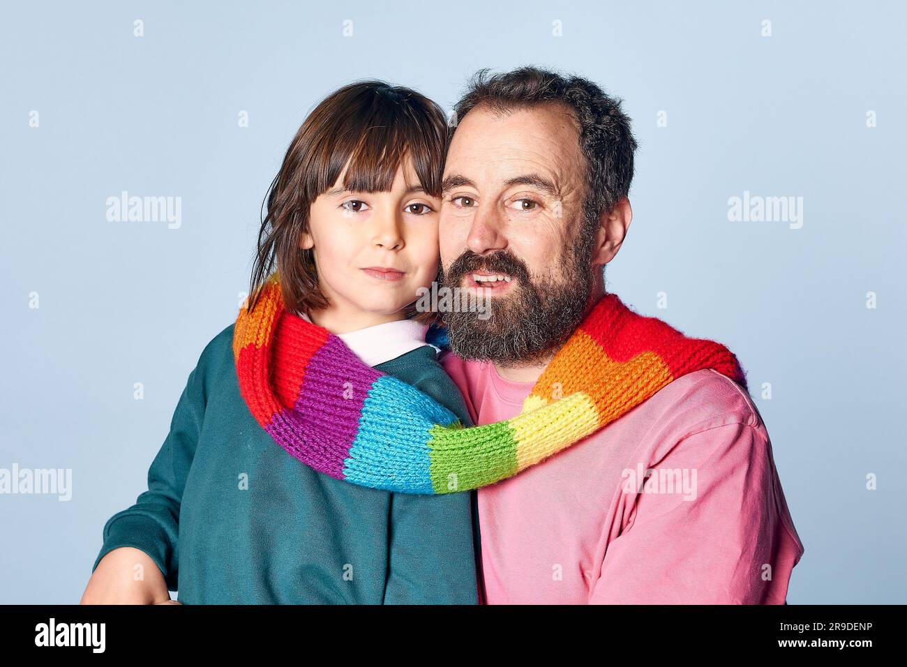 portrait of divorced lgbt father with his daughter in studio on ...